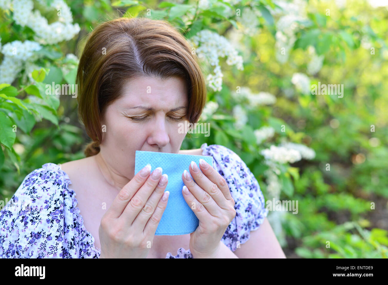 adult female with allergic rhinitis about a bird cherry blossoms Stock ...