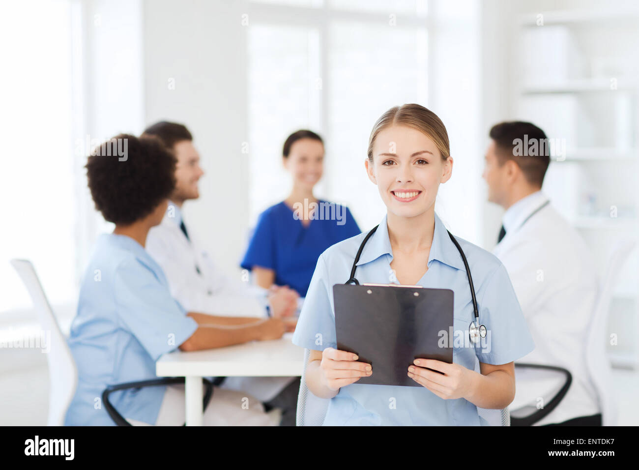 happy doctor over group of medics at hospital Stock Photo - Alamy