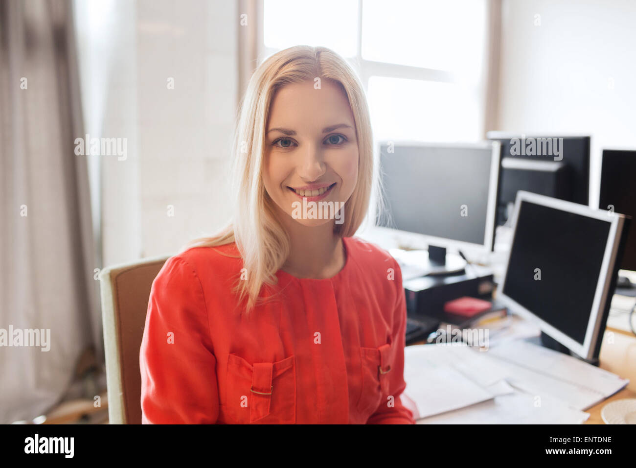 happy creative female office worker with computers Stock Photo - Alamy