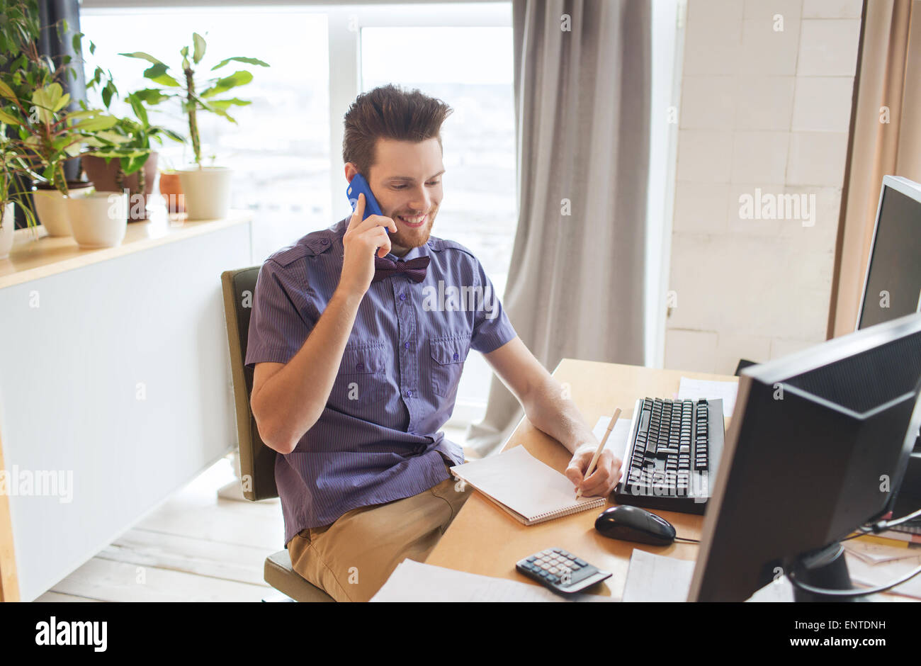 happy creative male worker calling on smarphone Stock Photo - Alamy