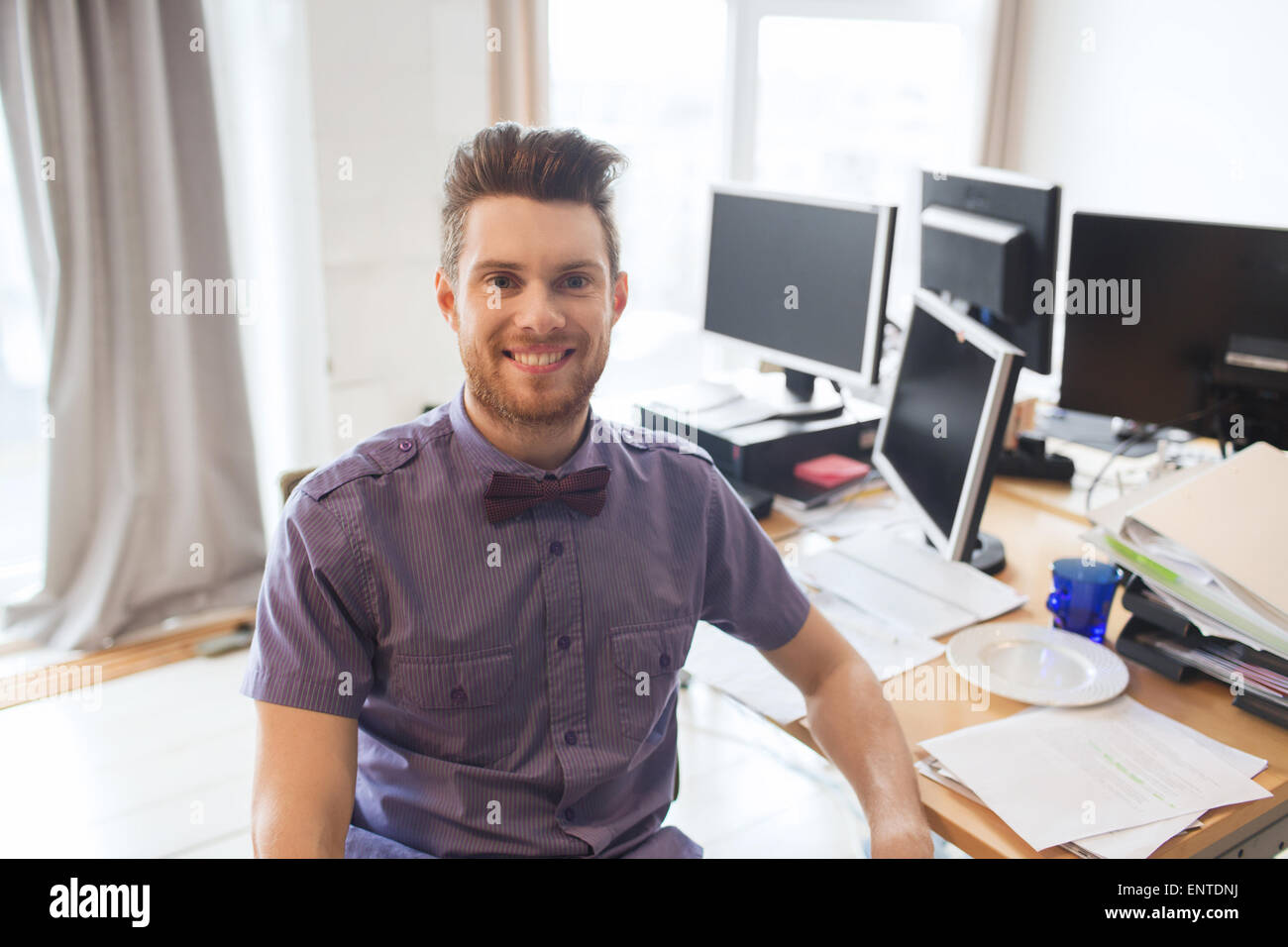 happy creative male office worker with computers Stock Photo - Alamy