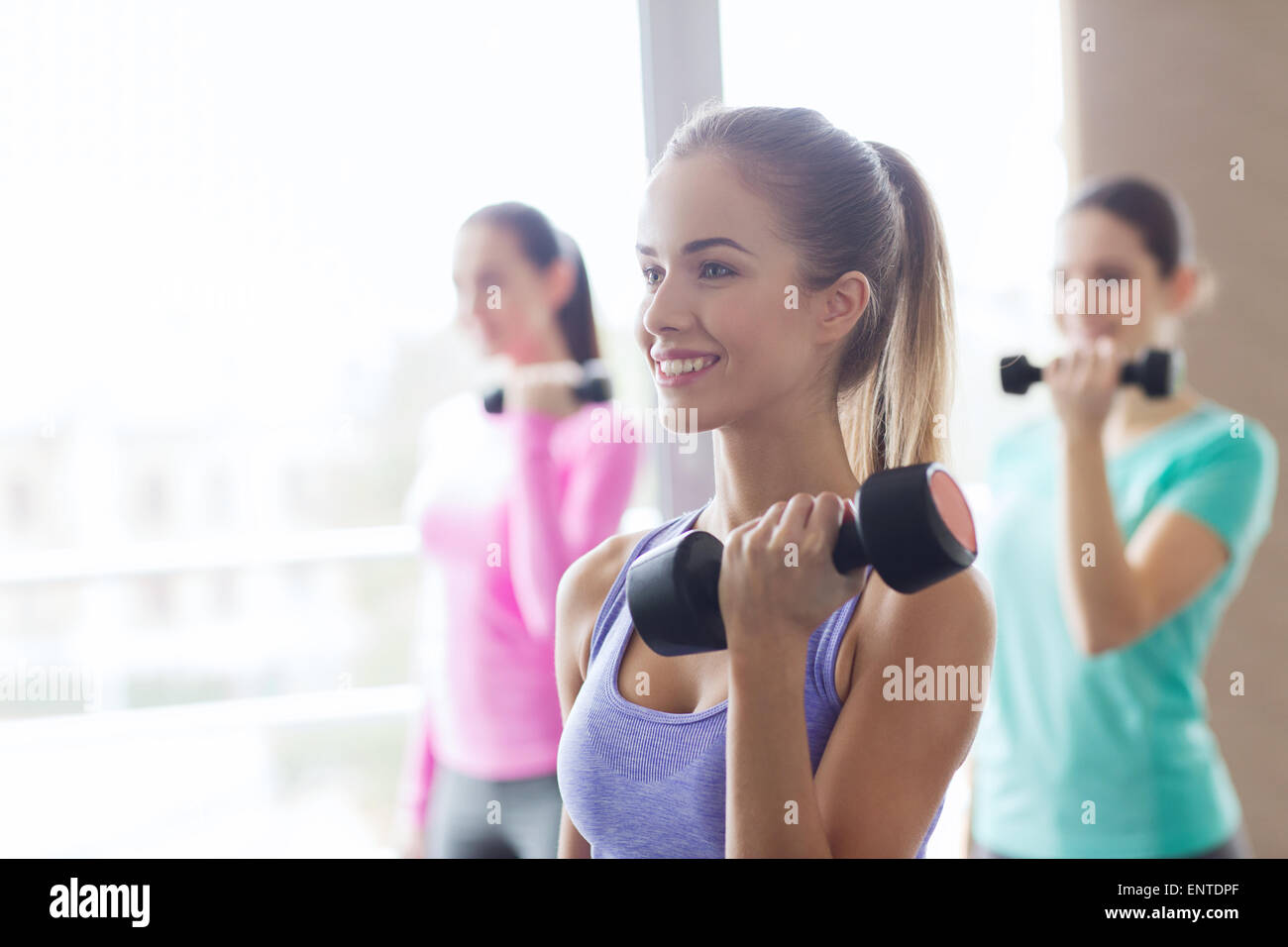 group of happy women with dumbbells in gym Stock Photo - Alamy