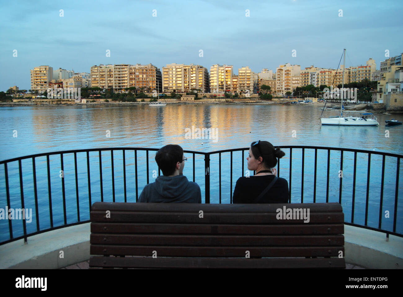 couple overlooking St Julian's Bay Malta Europe Stock Photo - Alamy