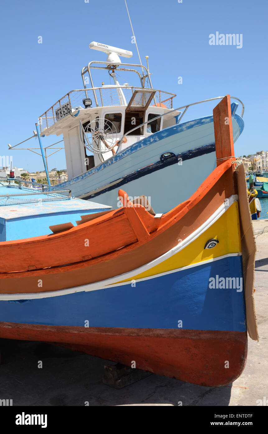 Traditional Maltese luzzu in Marsaxlokk harbour Stock Photo - Alamy