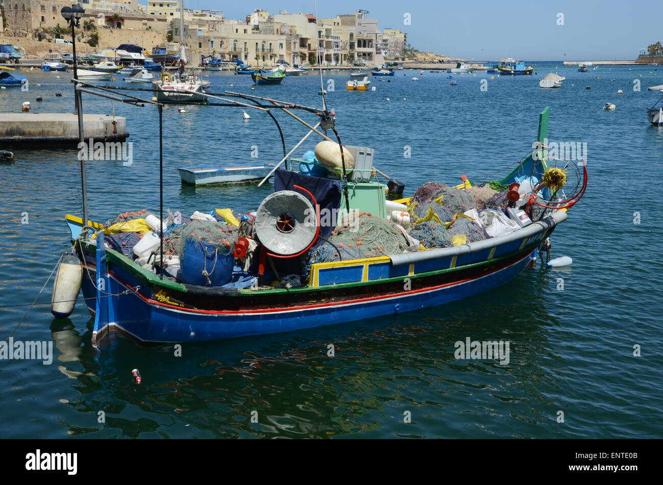 Traditional Maltese luzzu in Marsascala harbour Stock Photo - Alamy