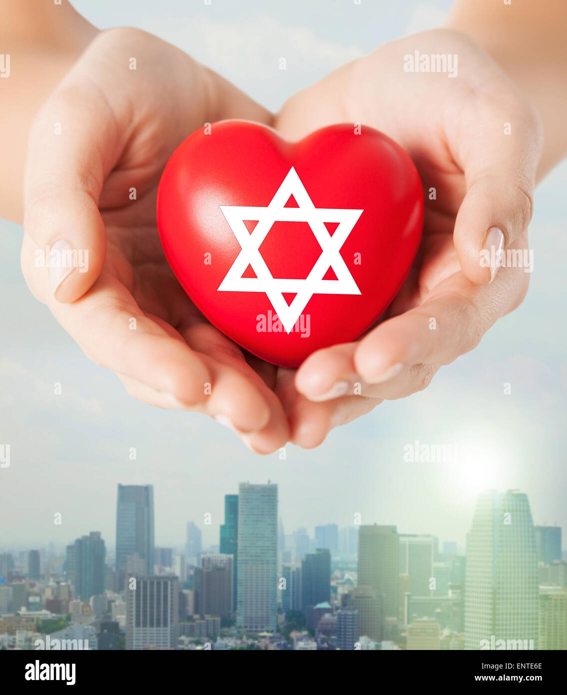close up of hands holding heart with jewish star Stock Photo - Alamy