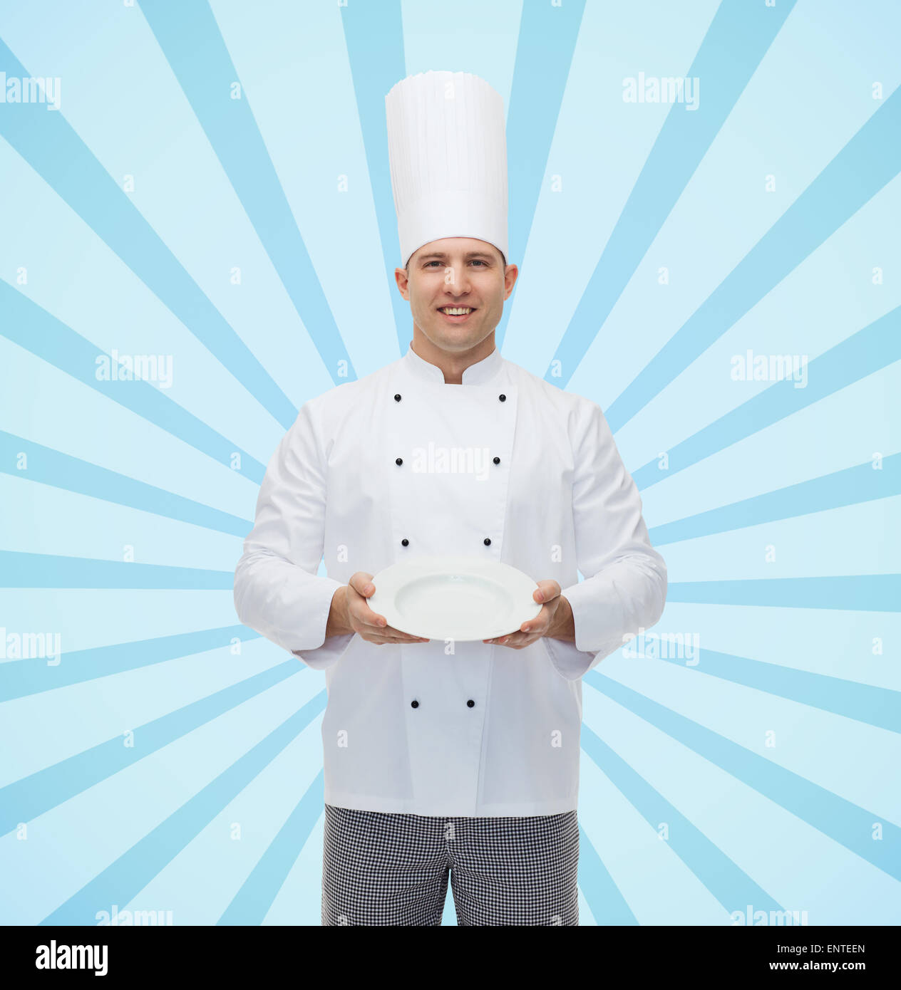 happy male chef cook showing empty plate Stock Photo - Alamy