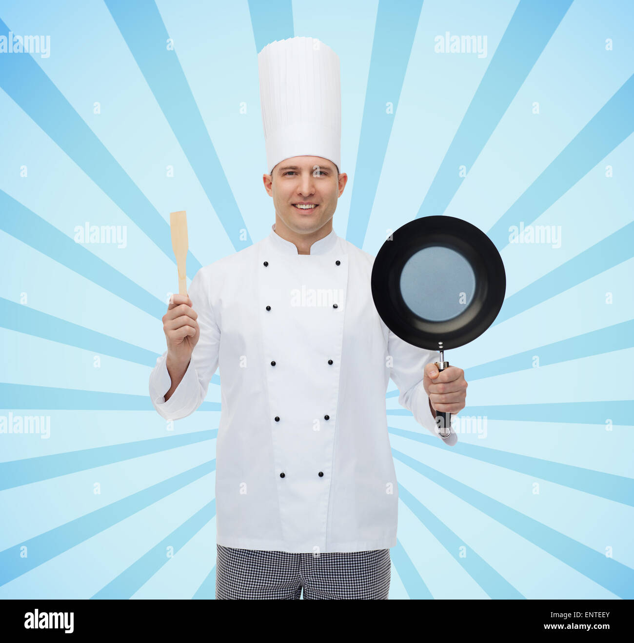 happy male chef holding frying pan and spatula Stock Photo - Alamy