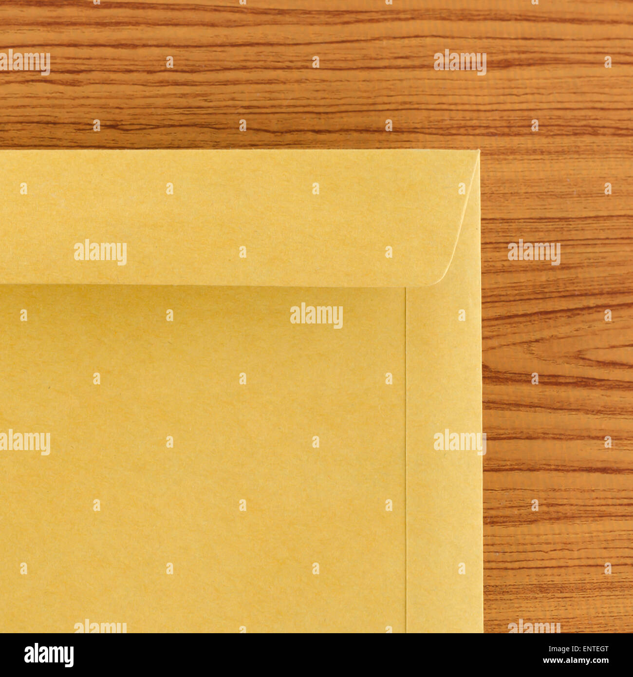 brown envelope on wood table background Stock Photo - Alamy