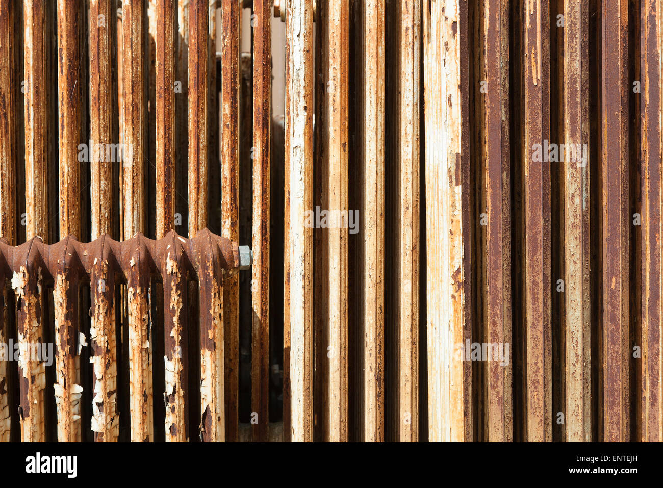 old central heating radiator with cracked white paint and rust Stock ...