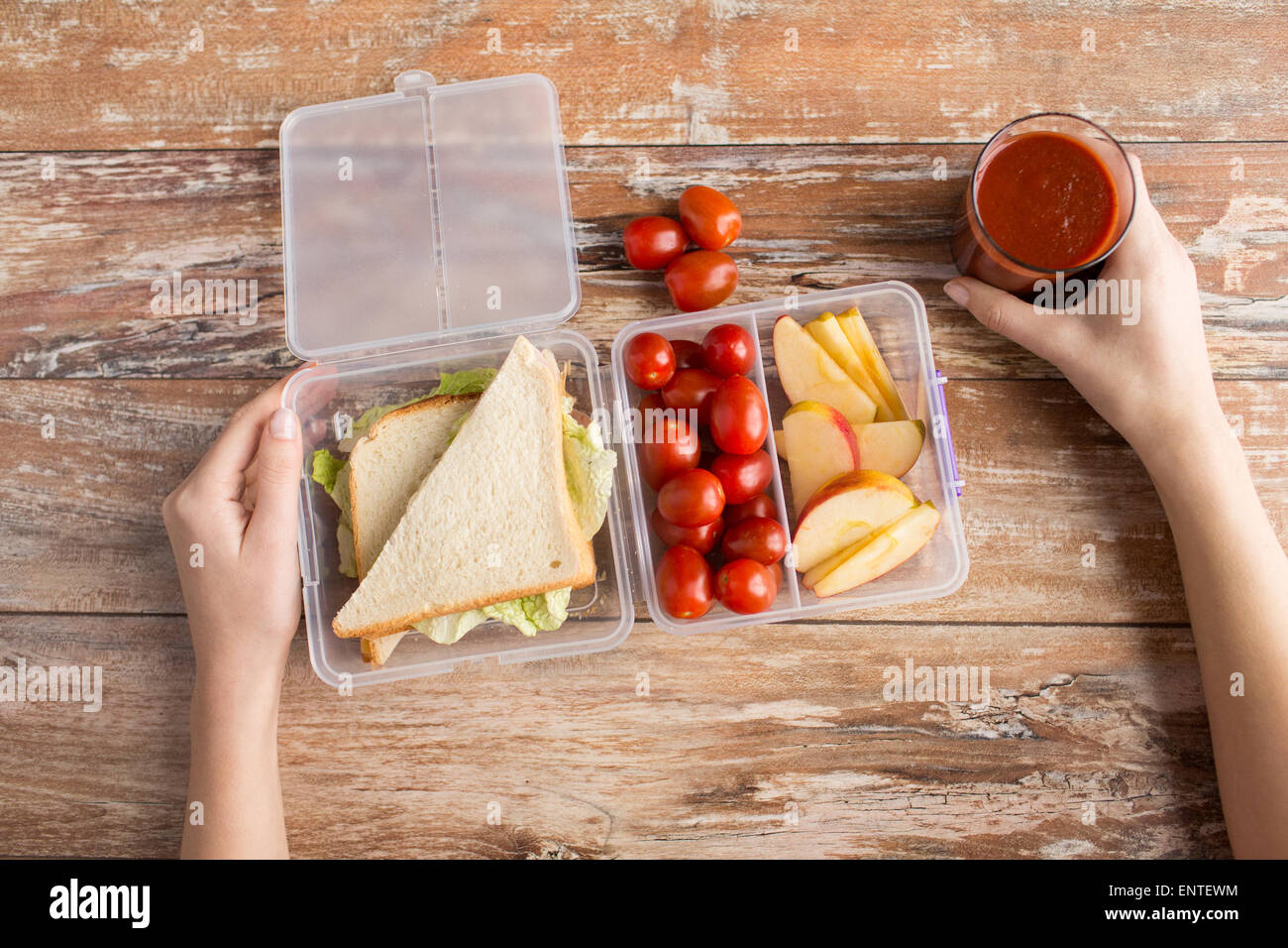 close up of woman with food in plastic container Stock Photo - Alamy