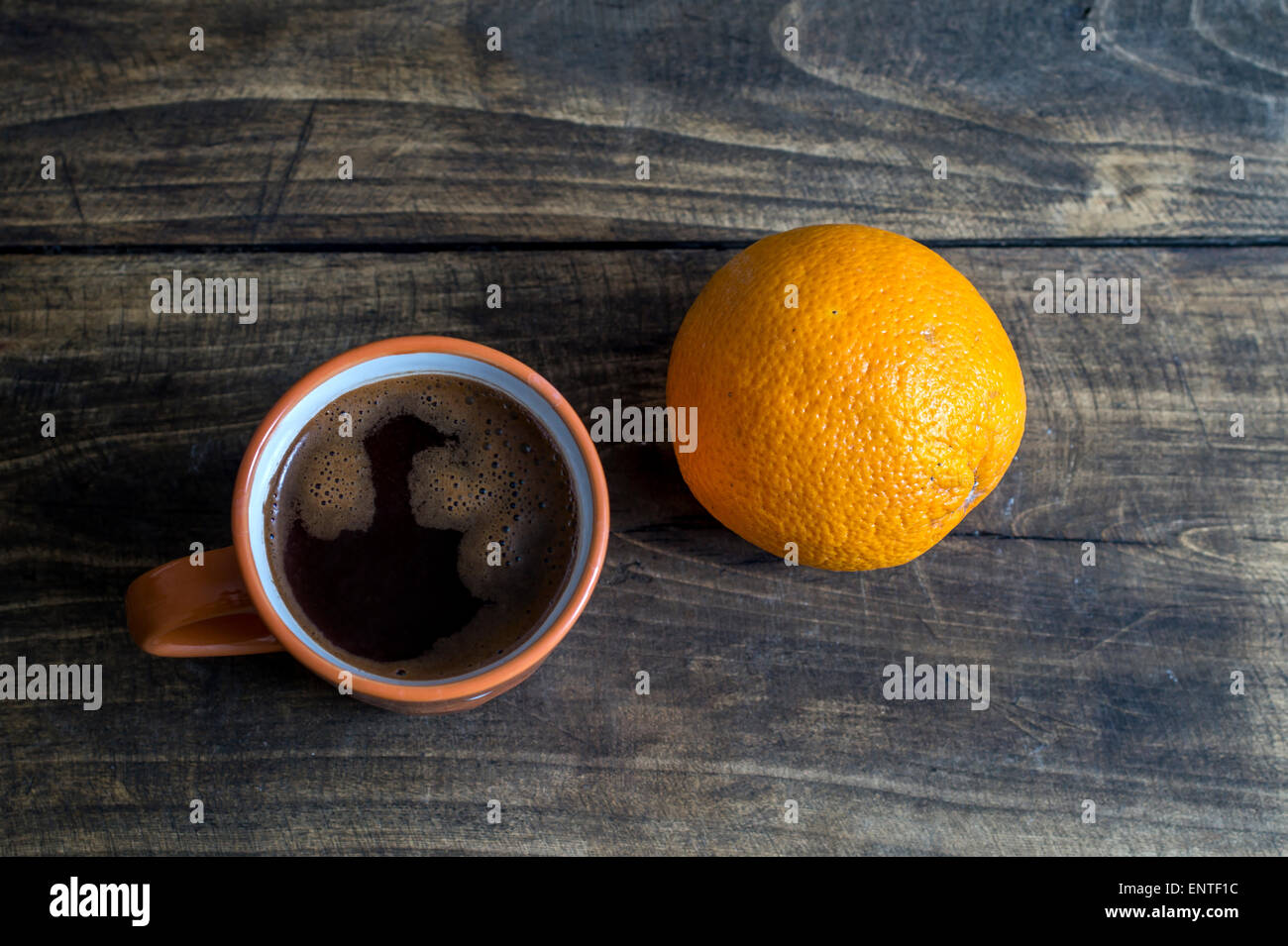 orange and a cup of coffee from above Stock Photo - Alamy