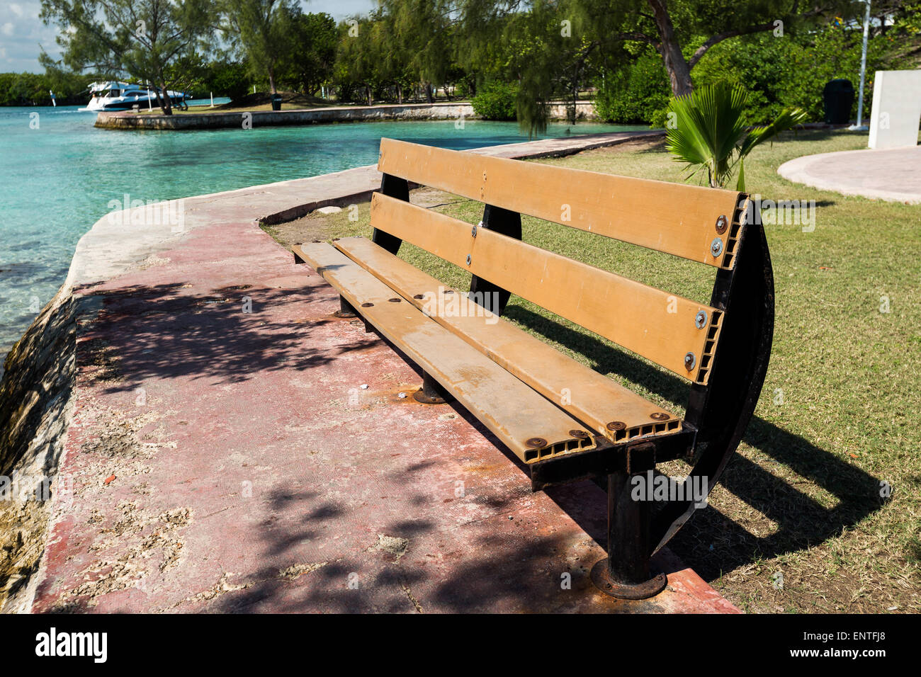 Wooden bench in park near caribbean lagoon Stock Photo - Alamy