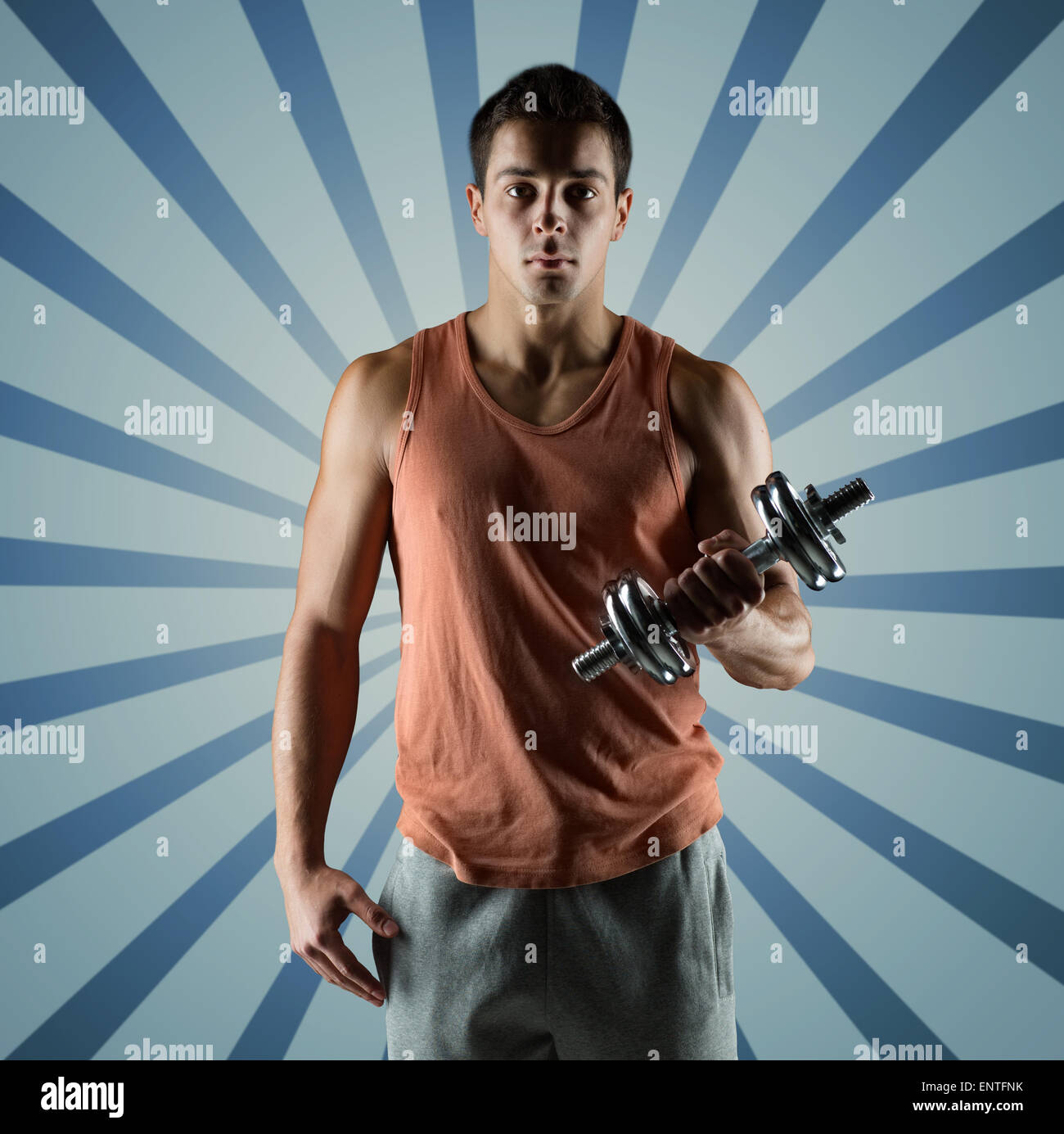 young man with dumbbell flexing biceps Stock Photo - Alamy