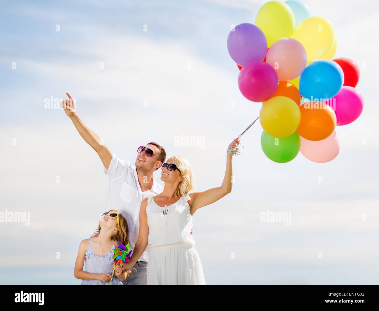family with colorful balloons Stock Photo - Alamy