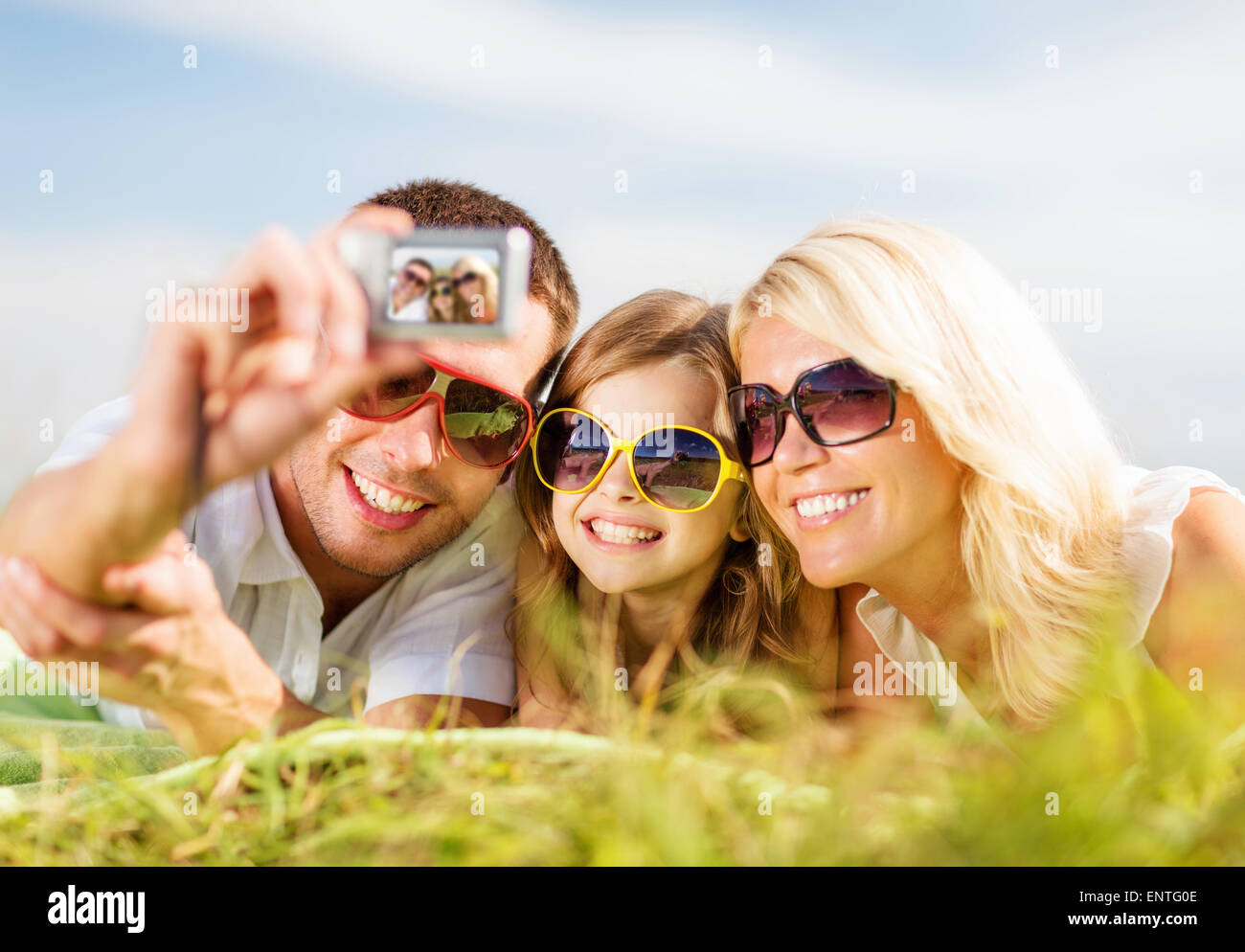 happy family with camera taking picture Stock Photo - Alamy