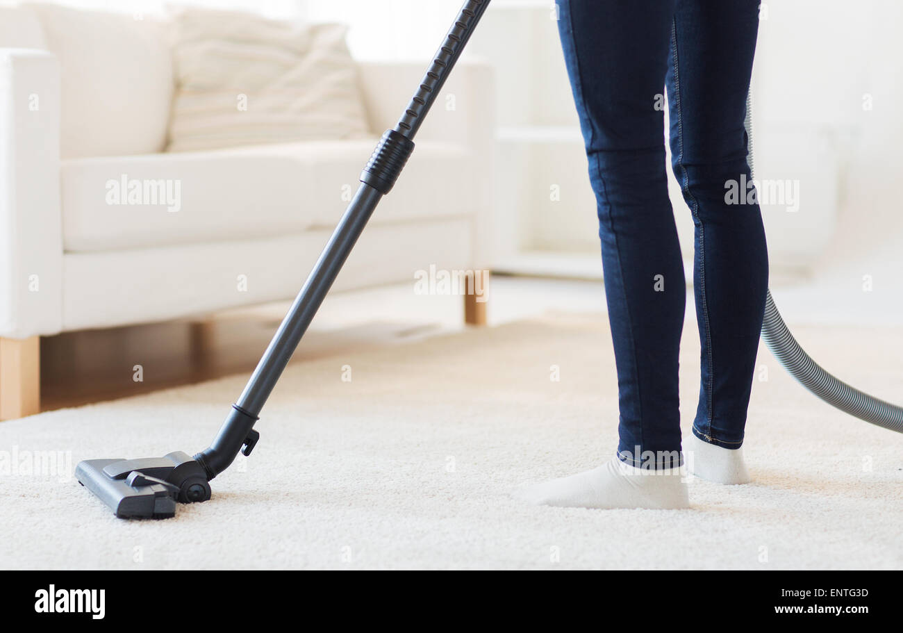 close up of woman legs with vacuum cleaner at home Stock Photo - Alamy