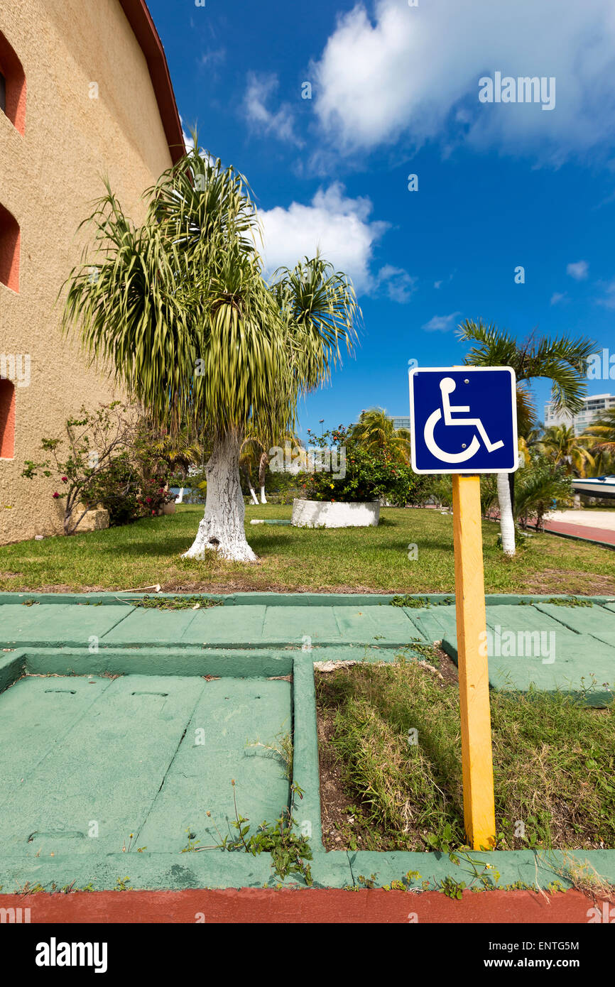 Blue handicapped sign with wheelchair, outdoors Stock Photo - Alamy