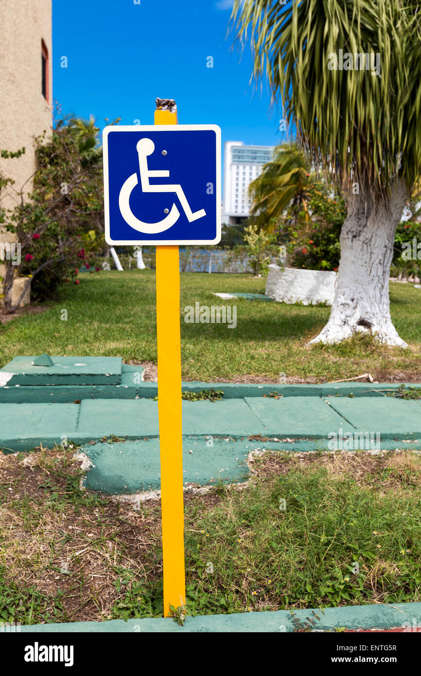 Blue handicapped sign with wheelchair, outdoors Stock Photo - Alamy