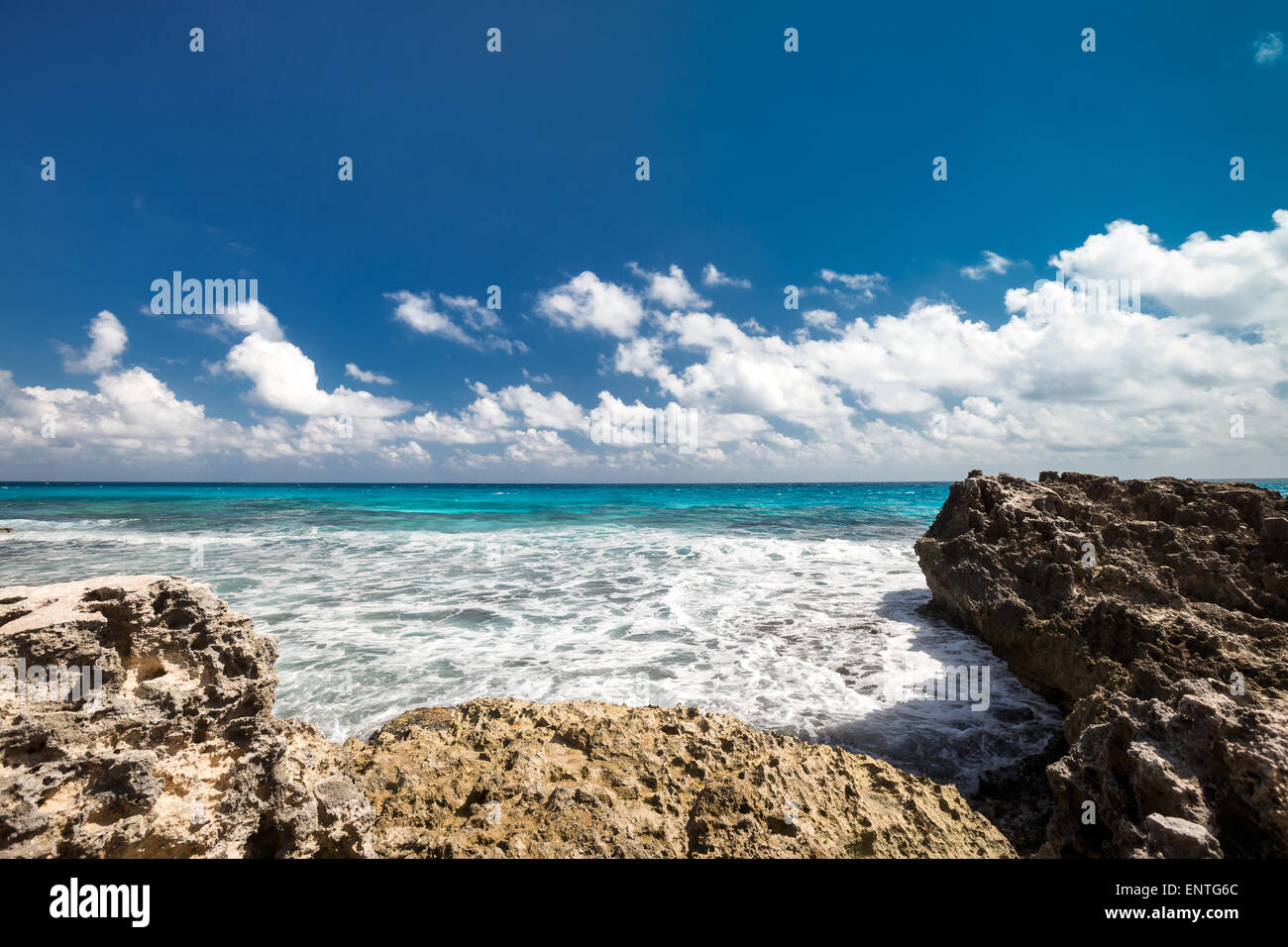 Ocean with waves and rocks on caribbean beach Stock Photo - Alamy