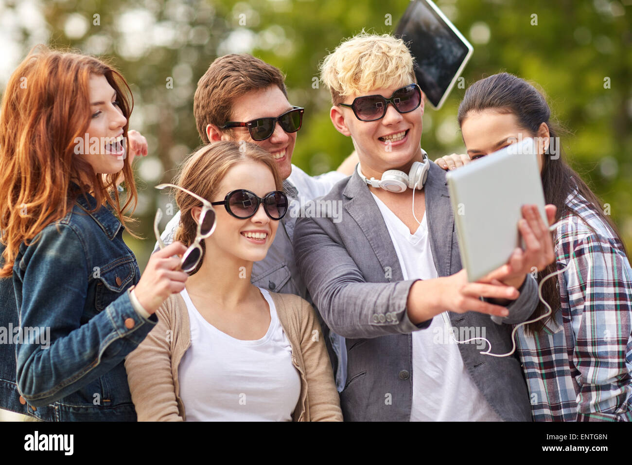students or teenagers with tablet pc taking selfie Stock Photo - Alamy