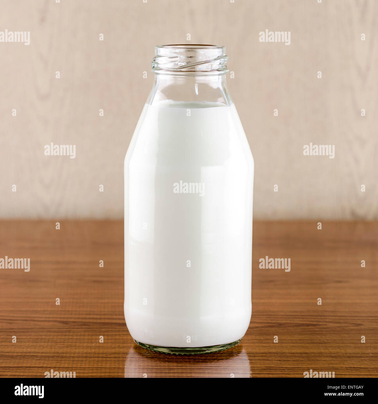 milk in a glass of bottle on wood table background Stock Photo - Alamy
