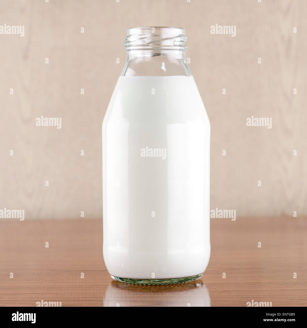 milk in a glass of bottle on wood table background Stock Photo - Alamy