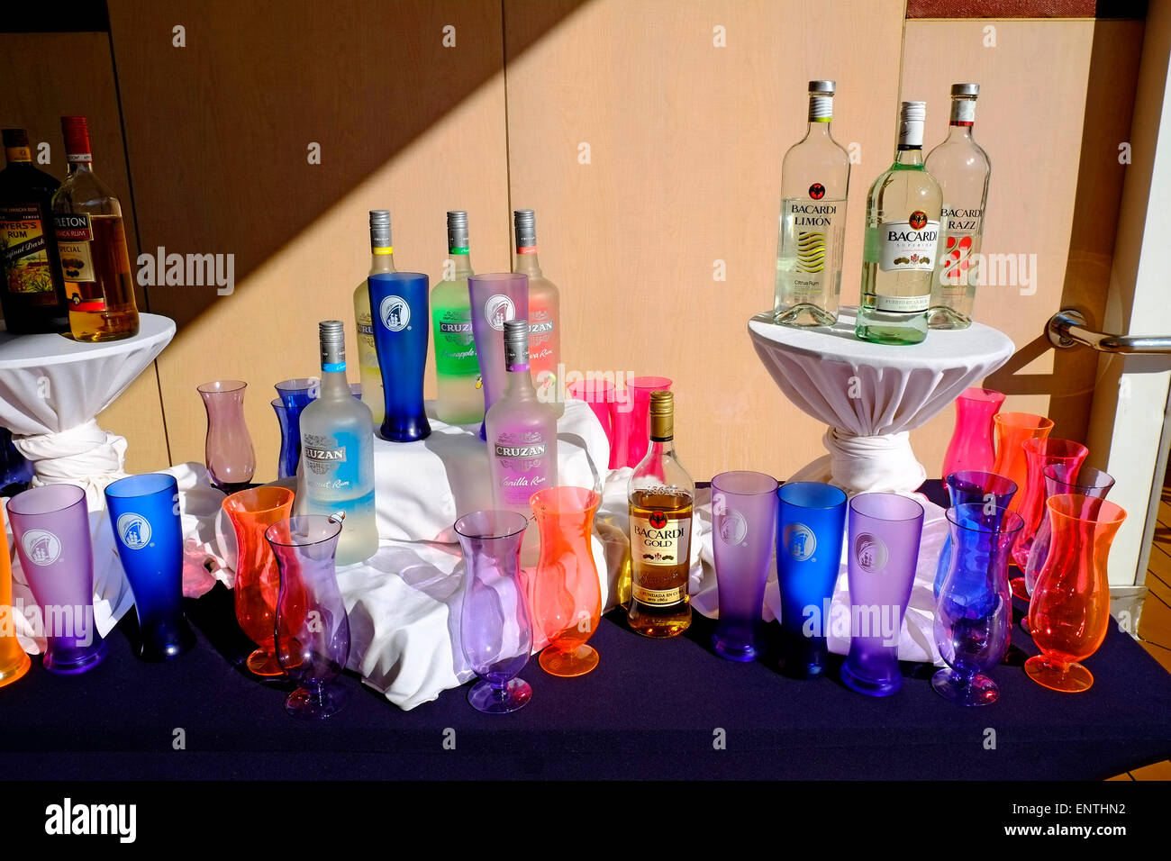 Colorful display of alcohol bottles and glasses Stock Photo - Alamy