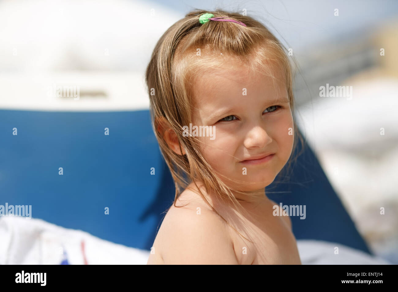 Close-up portrait of a child sunbathing on a sunny day. Shallow depth ...
