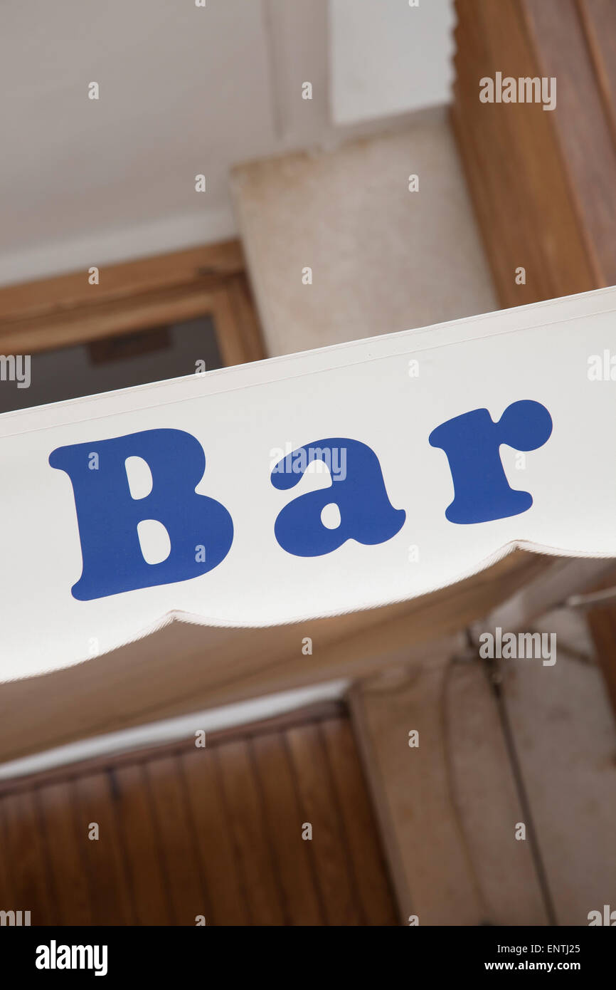 Blue Bar Sign in Urban Setting Stock Photo - Alamy