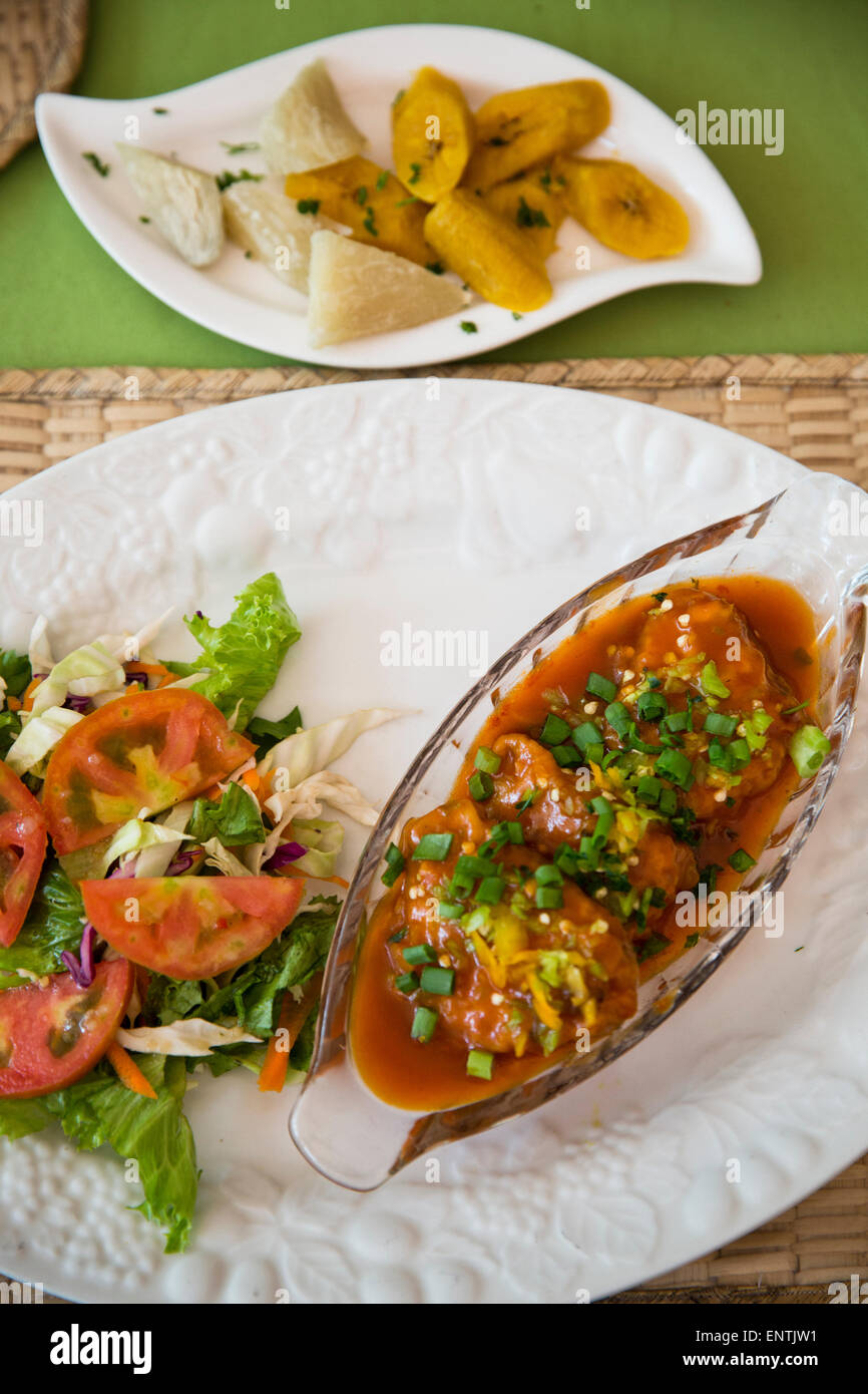 Overhead tabletop view of Fried fish in creole sauce with ground ...
