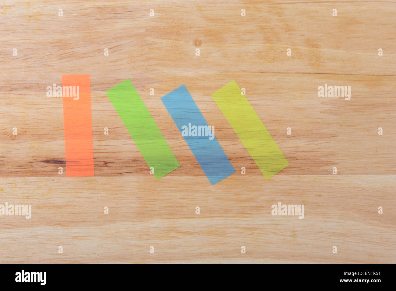notes four colours in vertical and diagonal on wood background Stock ...