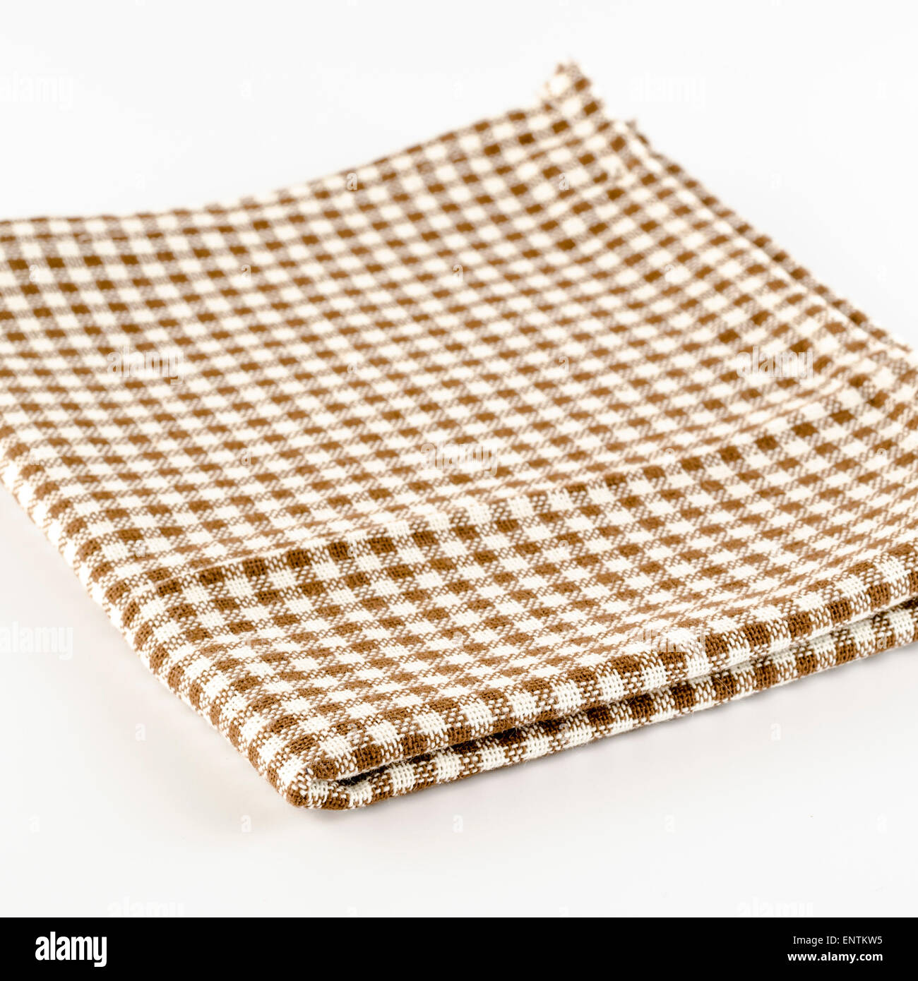 brown kitchen towel on a white background Stock Photo - Alamy