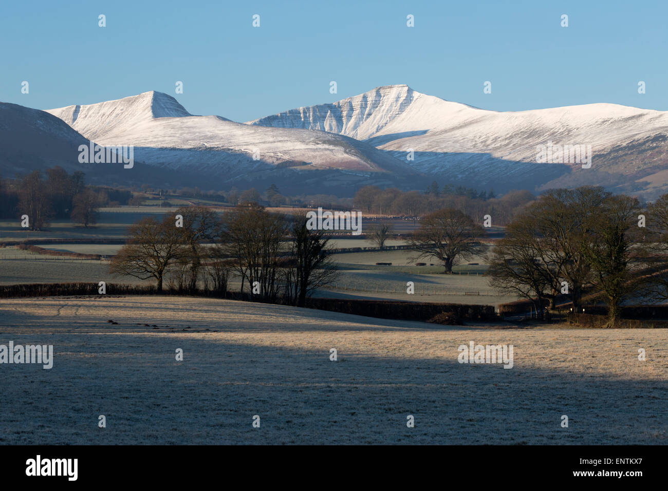 Snow covered peak of Pen y Fan in morning frost, Llanfrynach, Usk ...