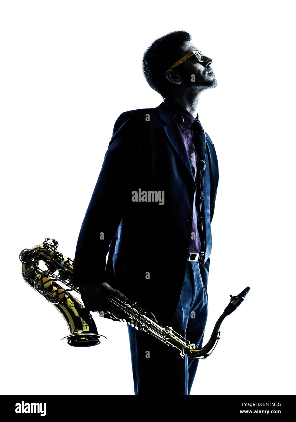 one caucasian man saxophonist playing saxophone player in studio ...