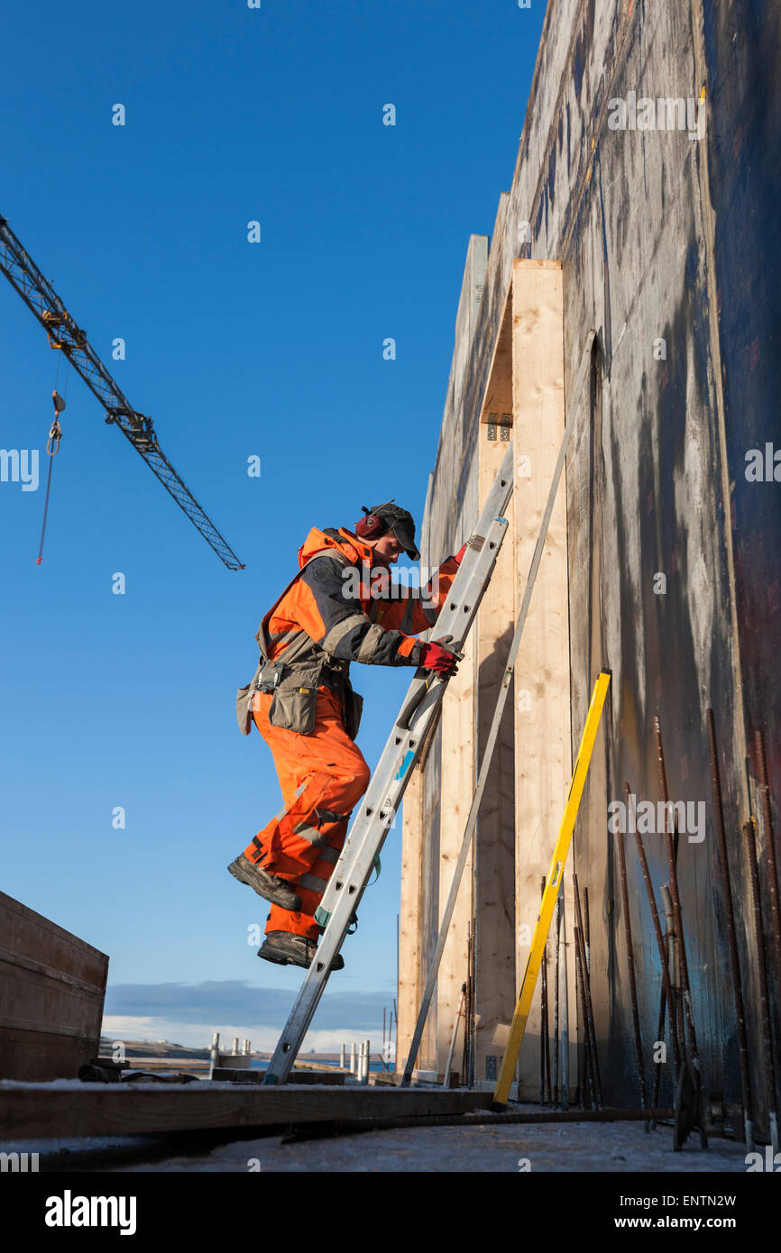 worker climbing a ladder Stock Photo - Alamy