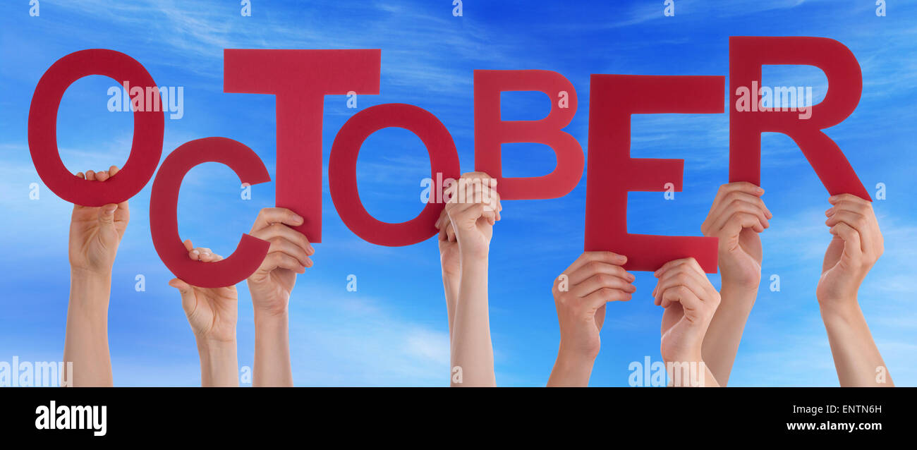 People Hands Holding Red Word October Blue Sky Stock Photo - Alamy