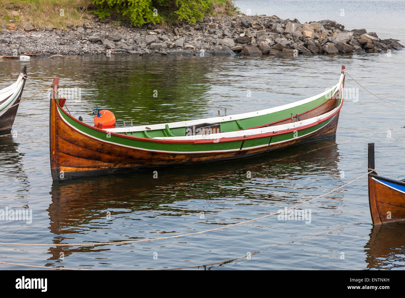 Small boat on clear water Stock Photo - Alamy
