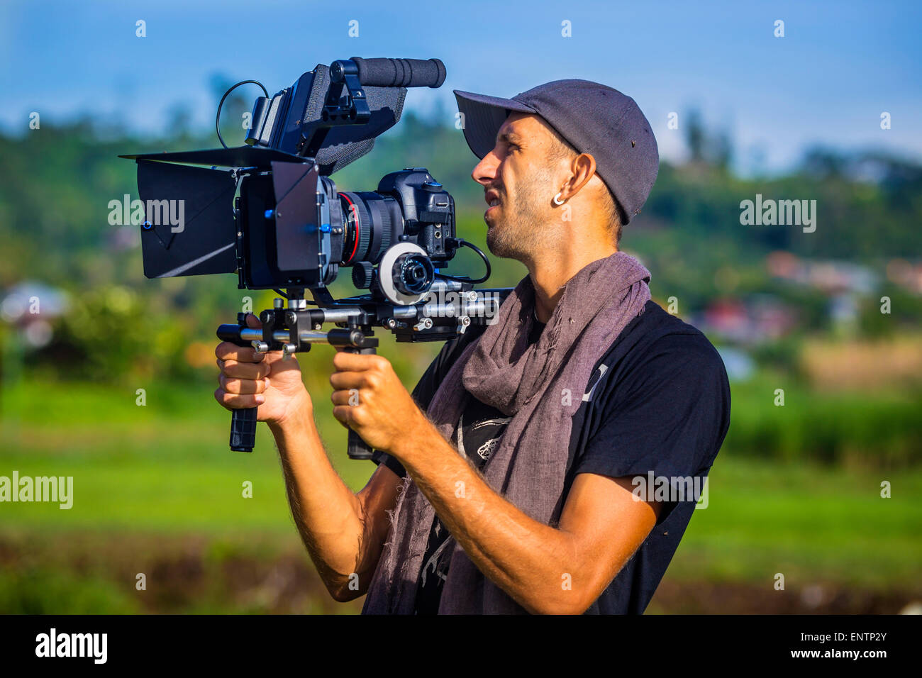 A cameraman holding camera in Bali,Indonesia Stock Photo - Alamy