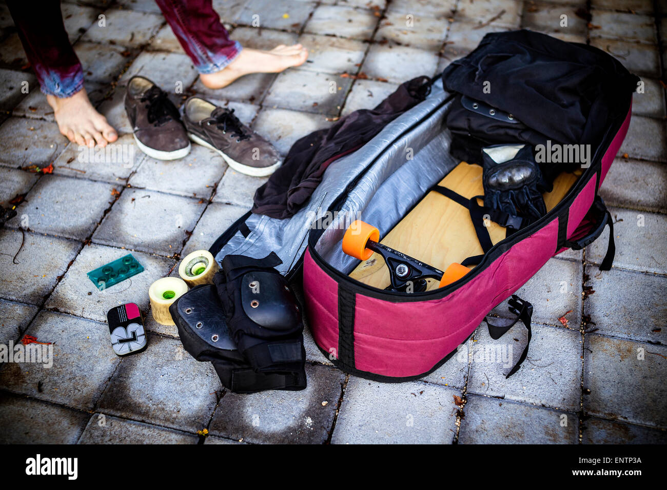 Man preparing for riding on a longboard skate, Bali, Indonesia Stock ...