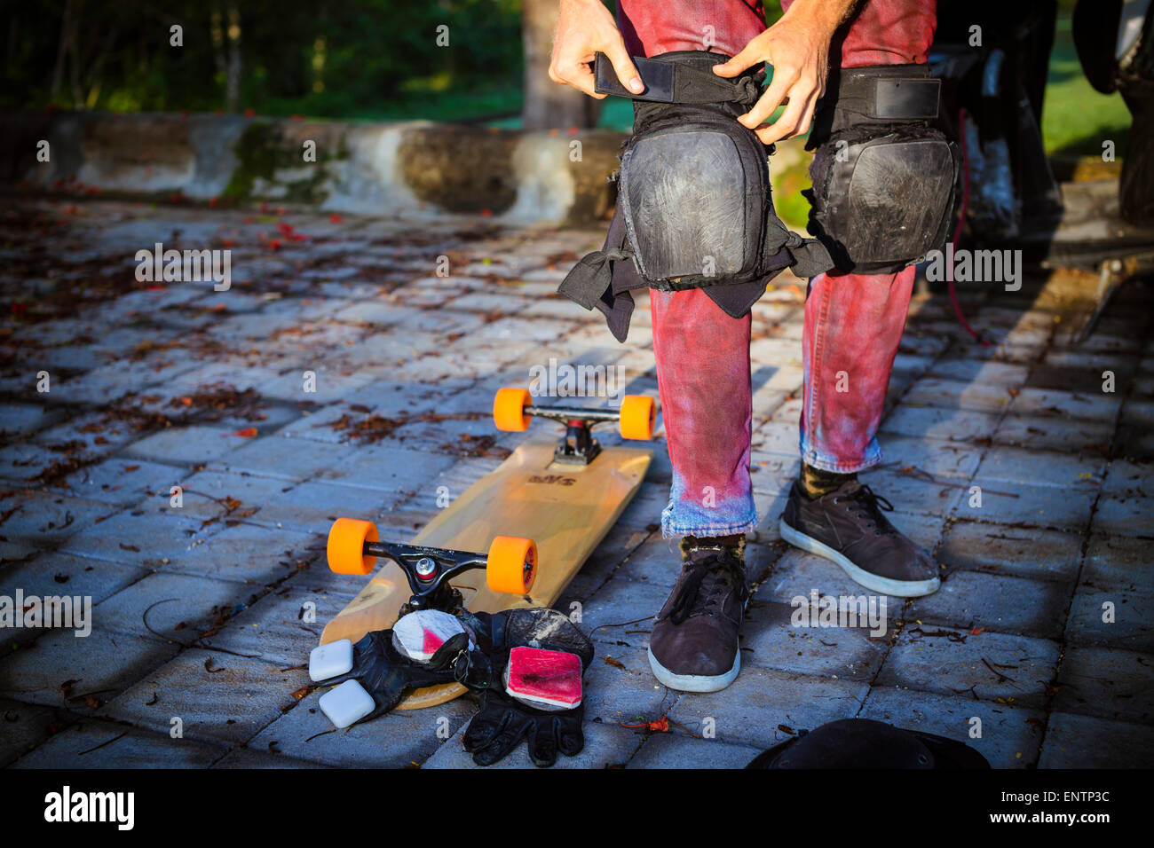 Man preparing for riding on a longboard skate, Bali, Indonesia Stock ...