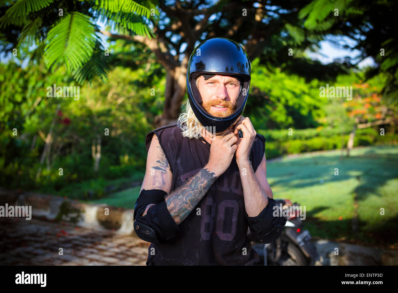 Man preparing for riding on a longboard skate, Bali, Indonesia Stock ...