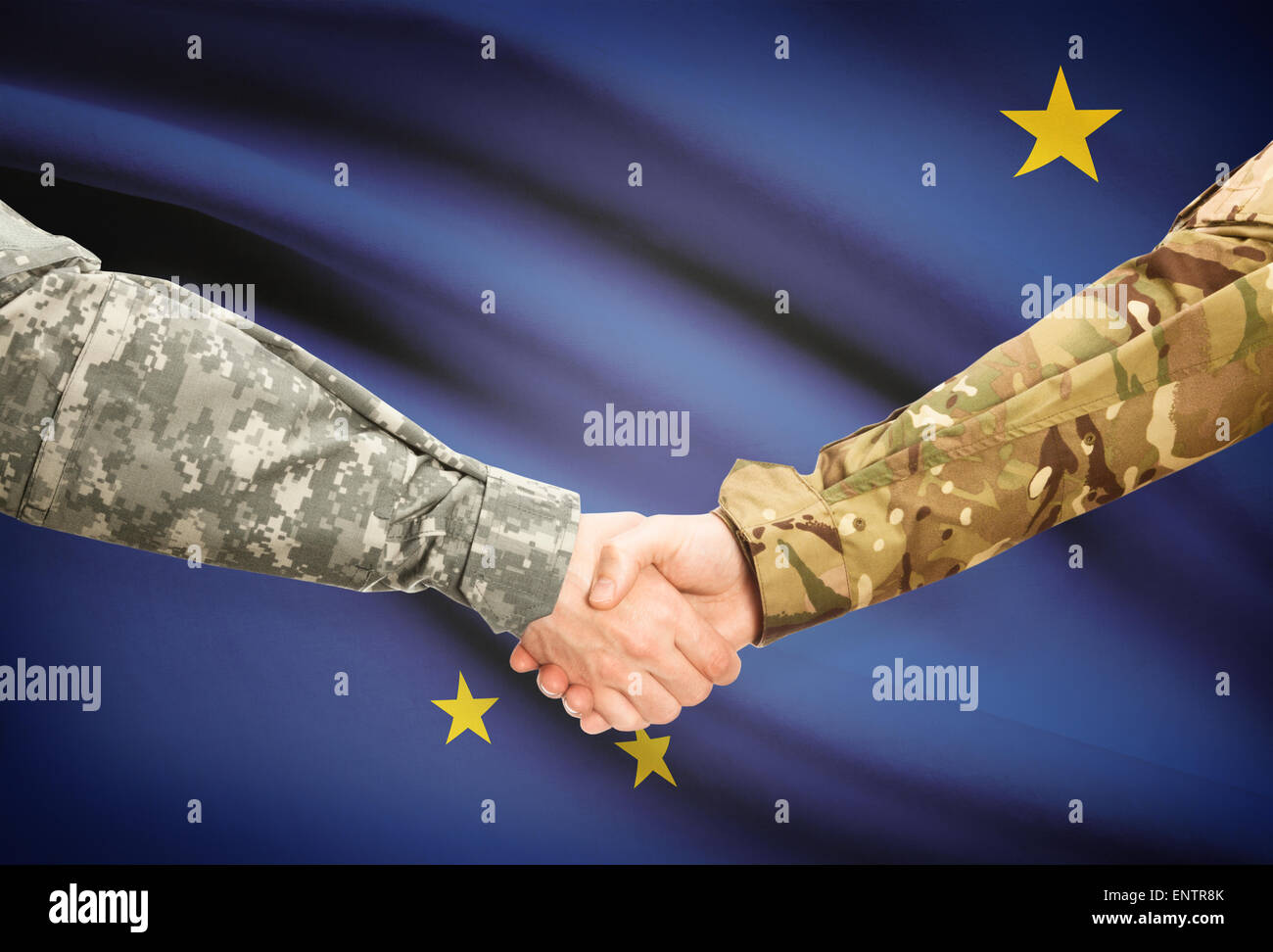 Soldiers handshake and US state flag - Alaska Stock Photo - Alamy