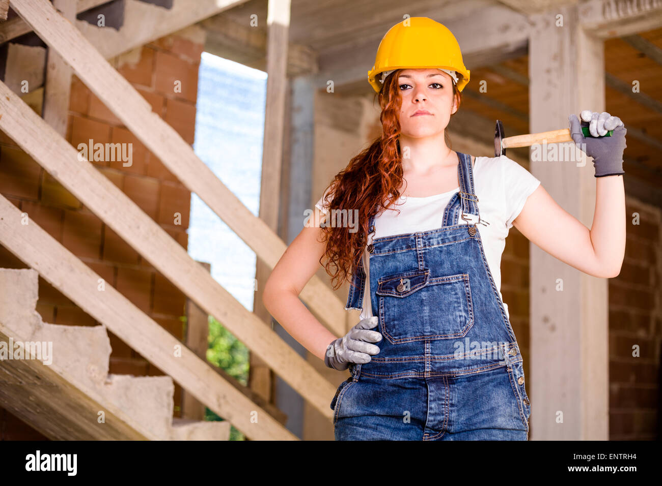 Woman holding hammer hi-res stock photography and images - Alamy