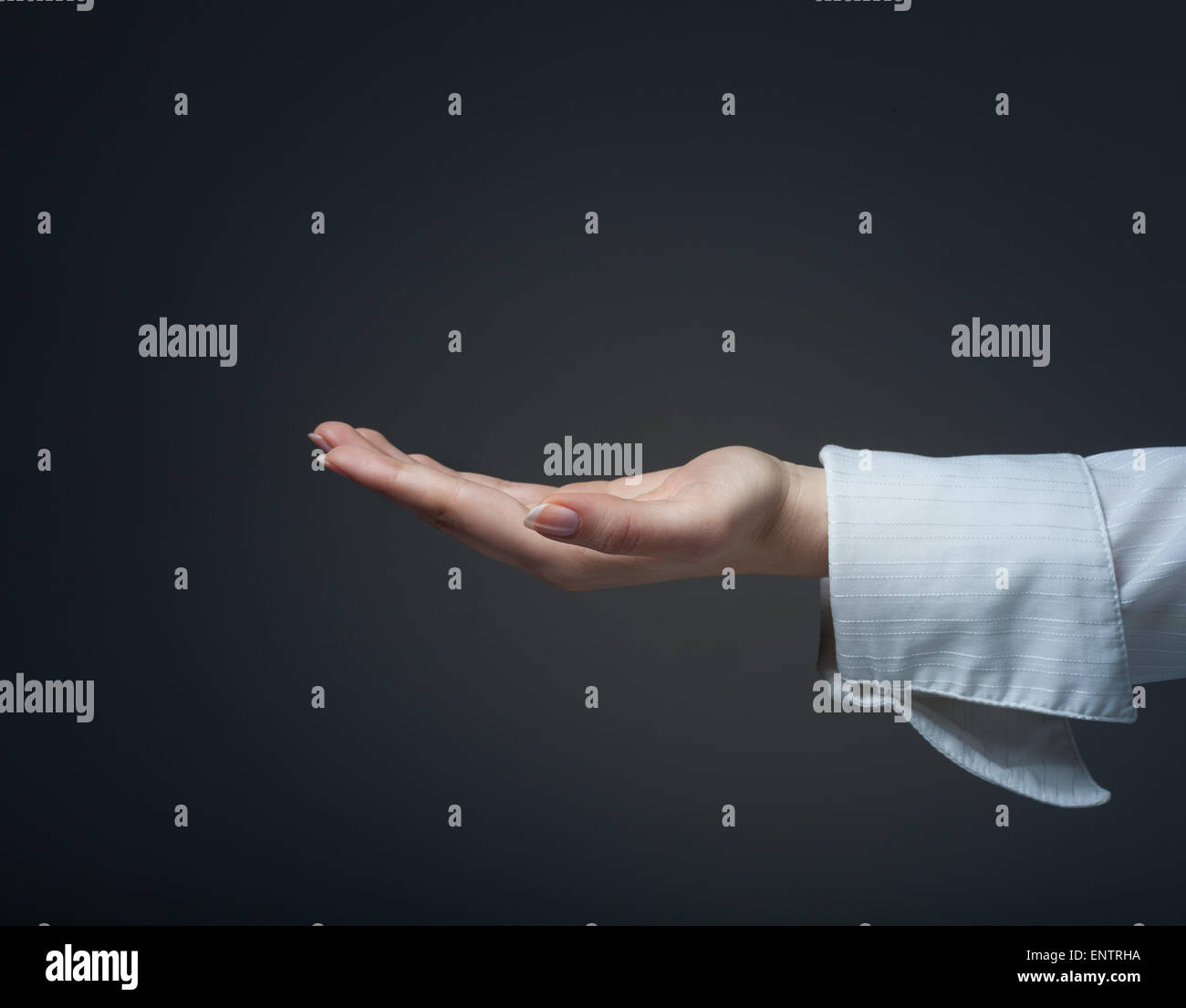 WoMan hand sign isolated on a dark background Stock Photo - Alamy