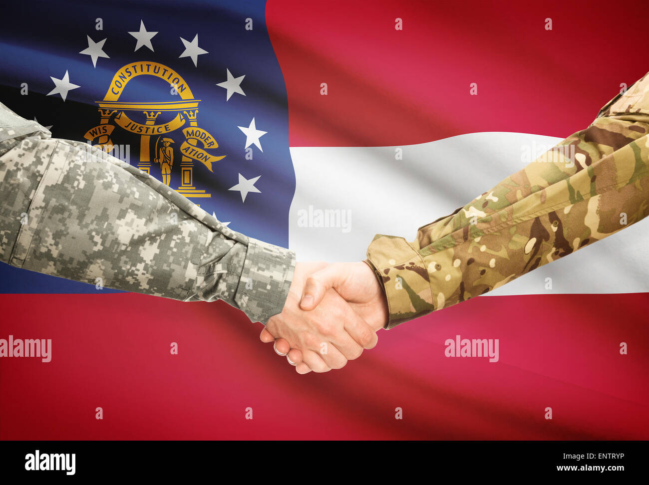 Soldiers handshake and US state flag - Georgia Stock Photo - Alamy