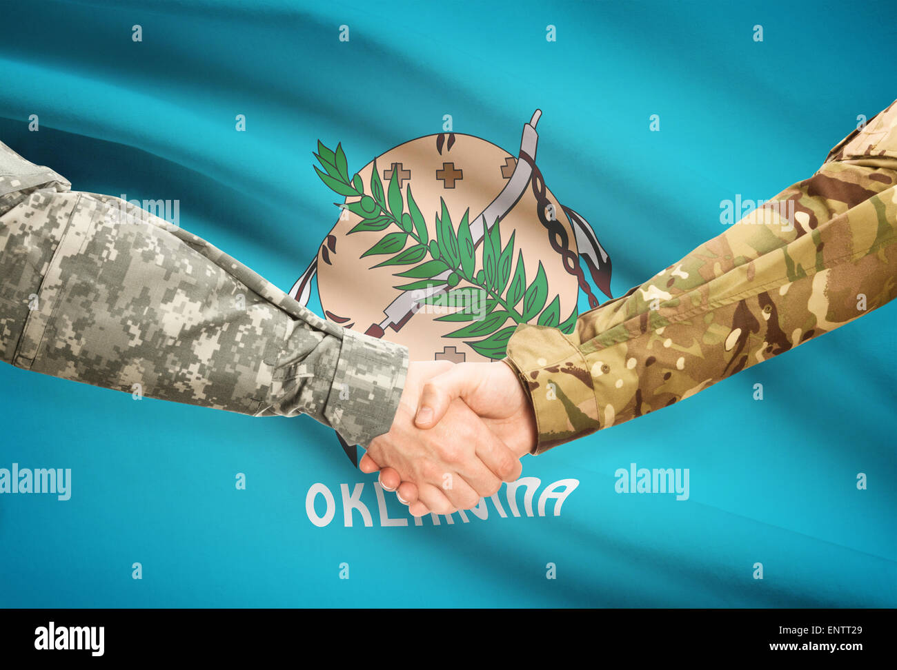 Soldiers handshake and US state flag - Oklahoma Stock Photo - Alamy