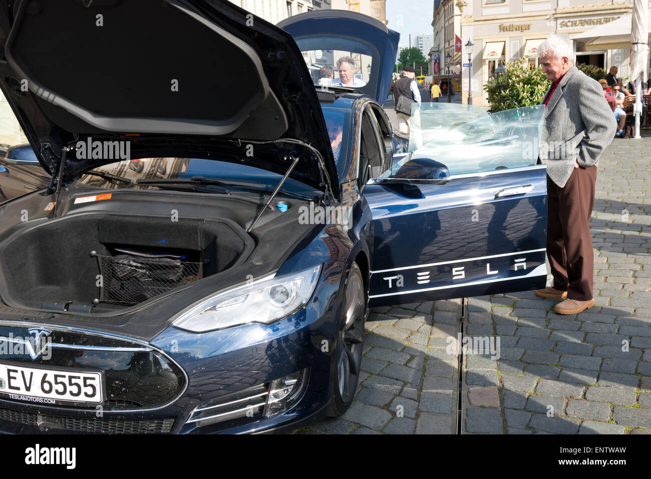 People watching at new electric car TESLA in centre of Dresden, May 8 ...