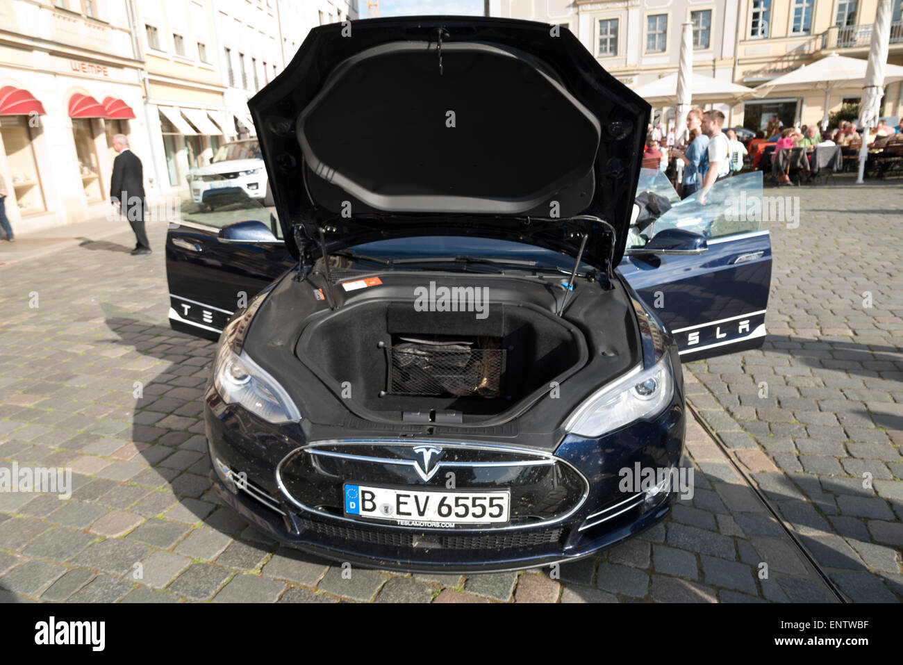 People watching at new electric car TESLA in centre of Dresden, May 8 ...