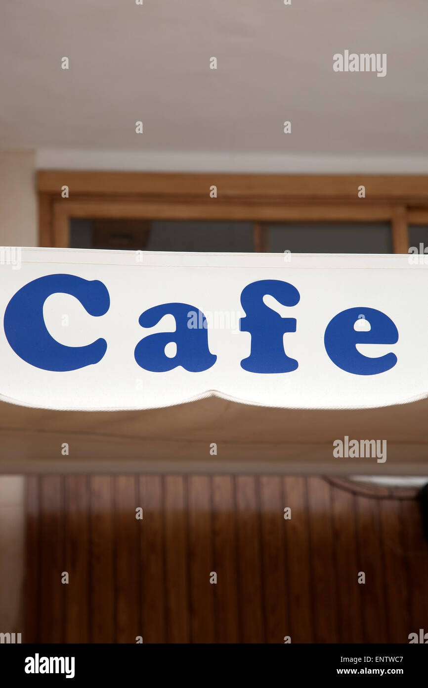 Blue Cafe Sign in Urban Setting Stock Photo - Alamy
